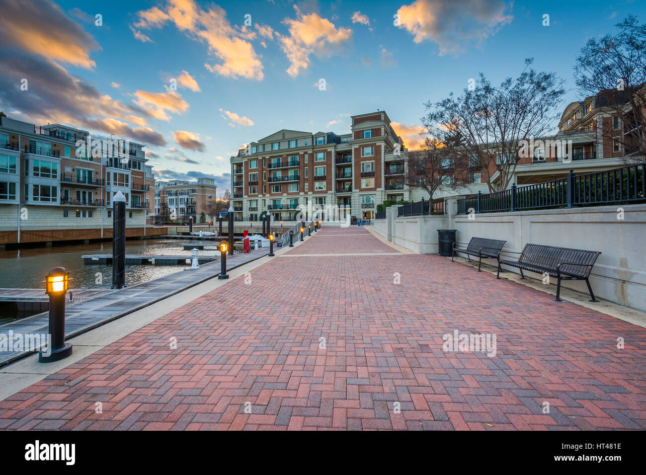 The Waterfront Promenade and waterfront residences at sunset, at the ...