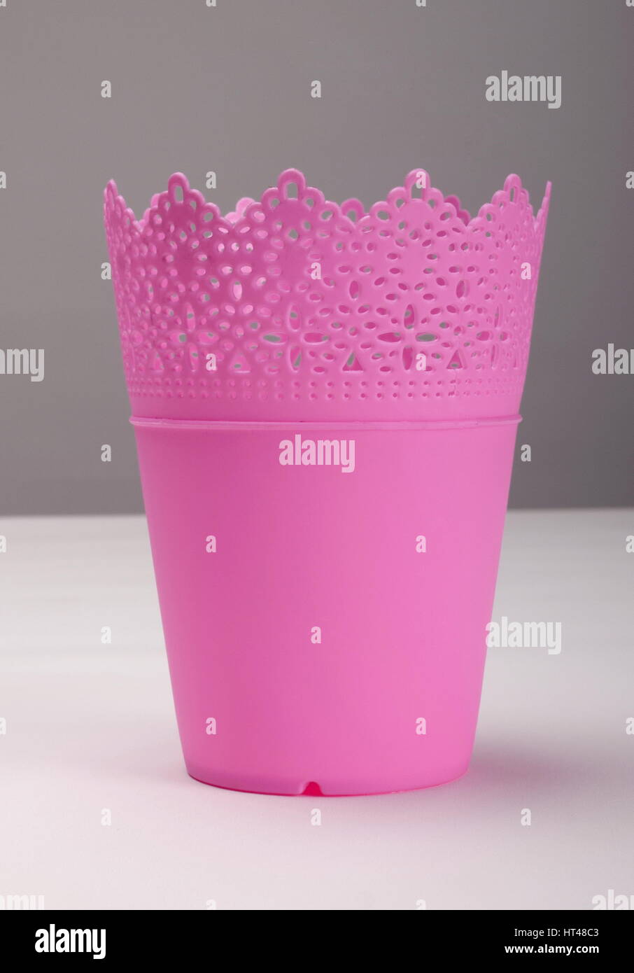 Empty pink plastic flower pot, front view Stock Photo - Alamy