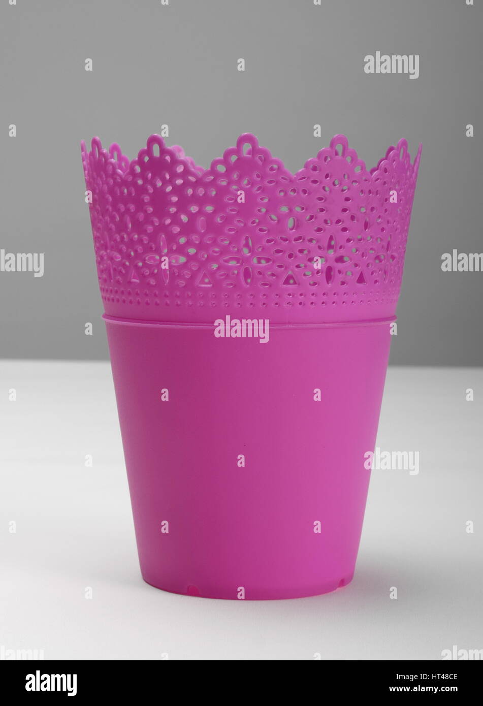 Empty pink plastic flower pot, front view Stock Photo - Alamy