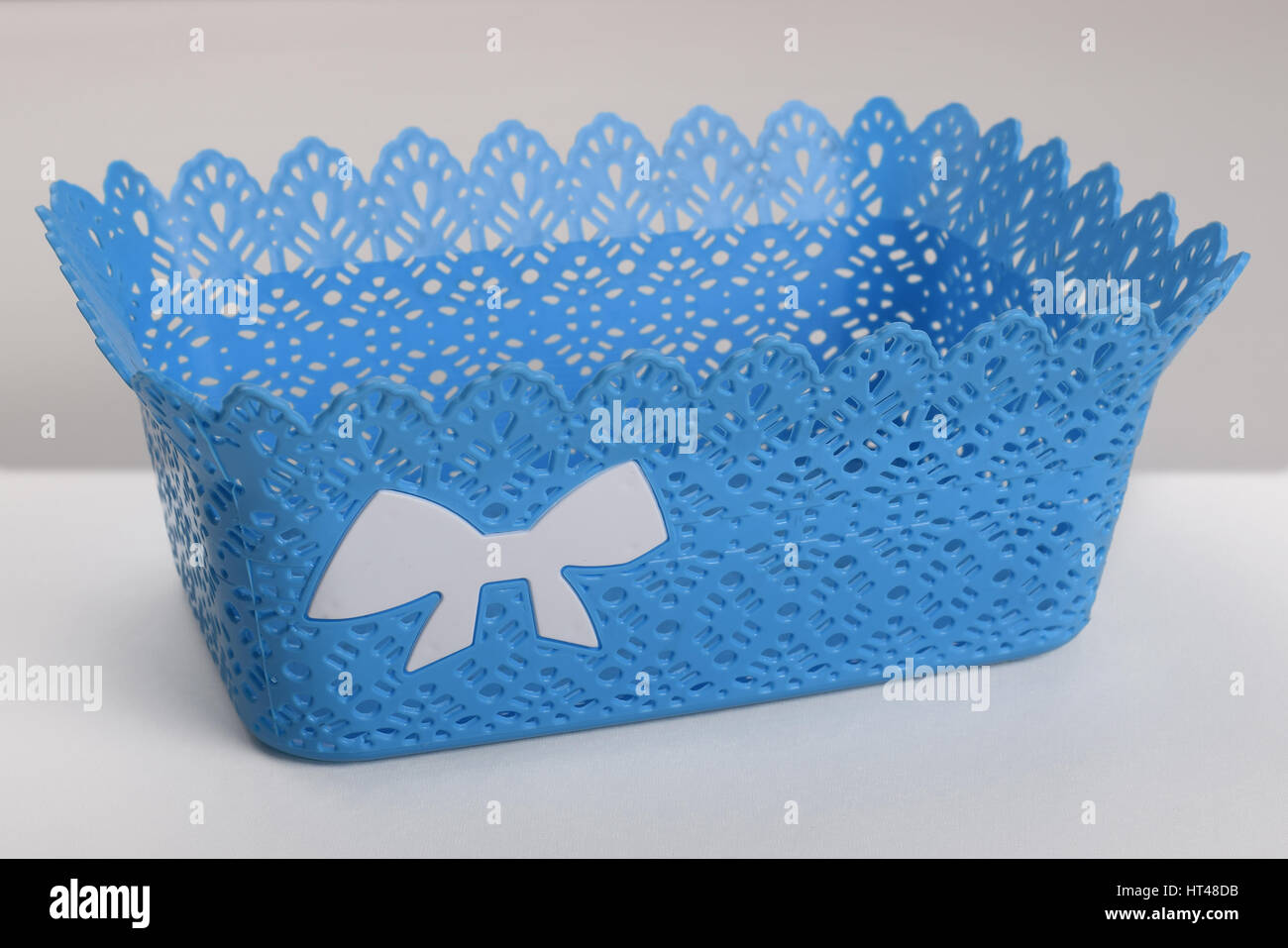 Blue plastic basket, front view Stock Photo - Alamy