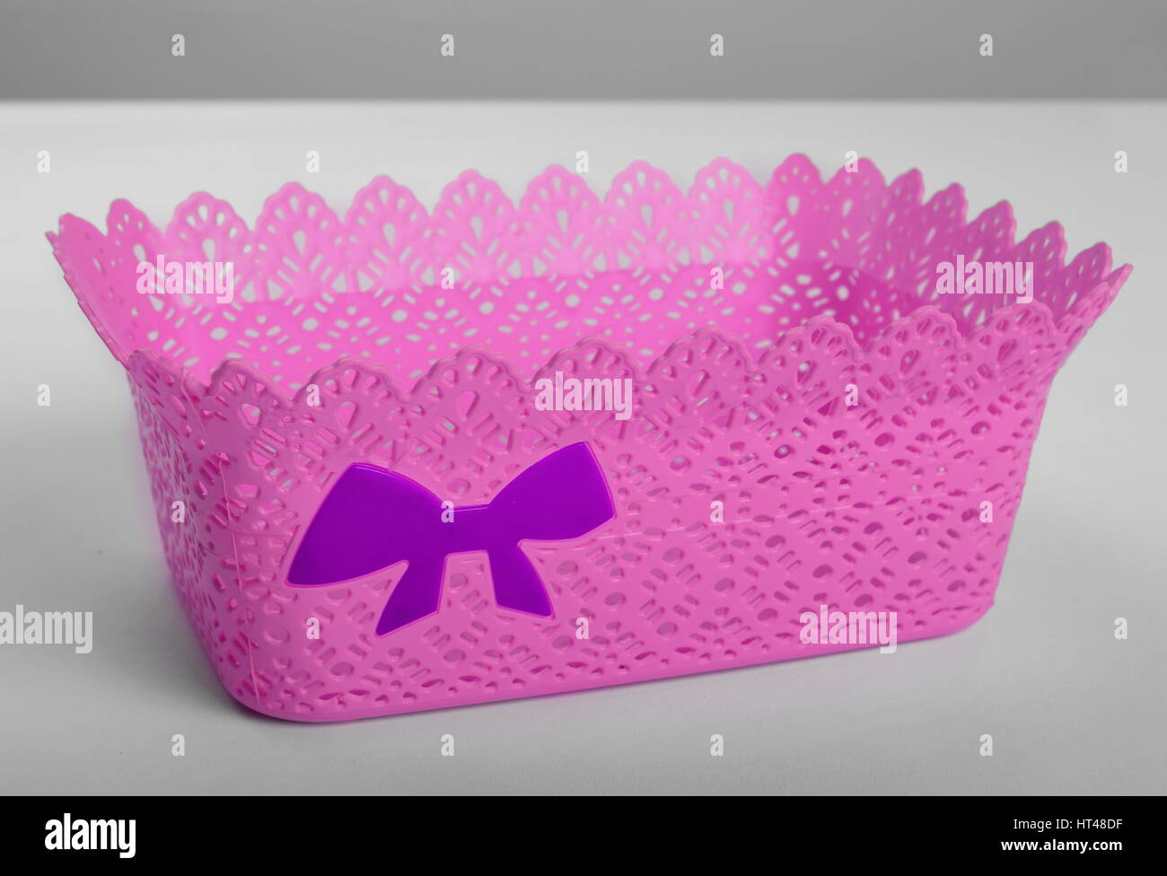 Pink plastic basket, front view Stock Photo - Alamy