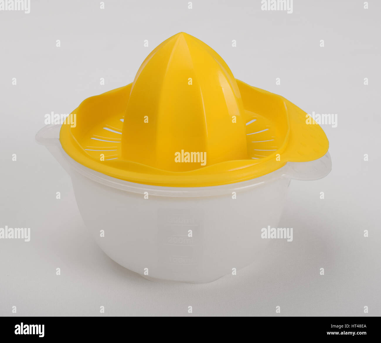 Plastic lemon-squeezer isolated on white background Stock Photo - Alamy
