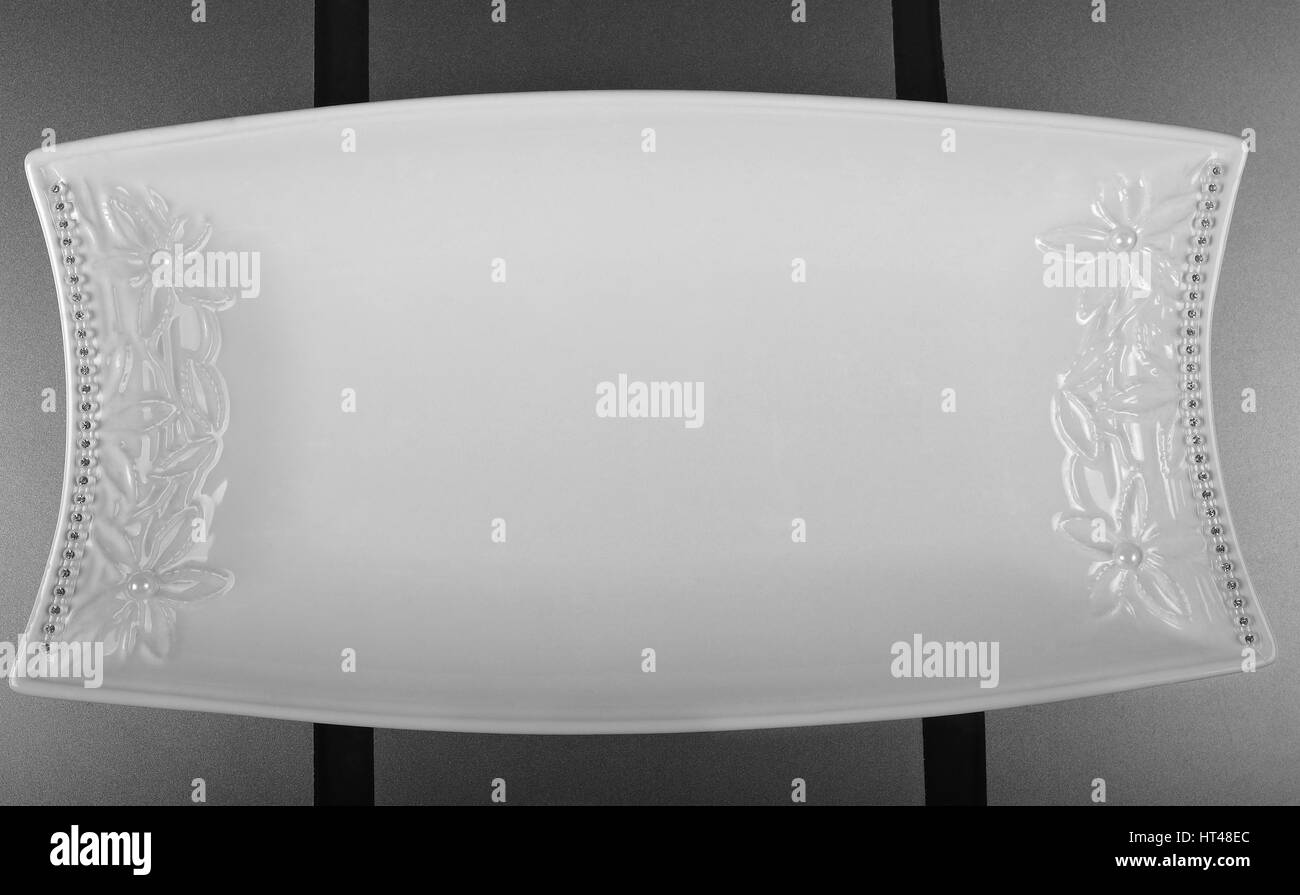 Shallow porcelain bowl with engraving Stock Photo - Alamy