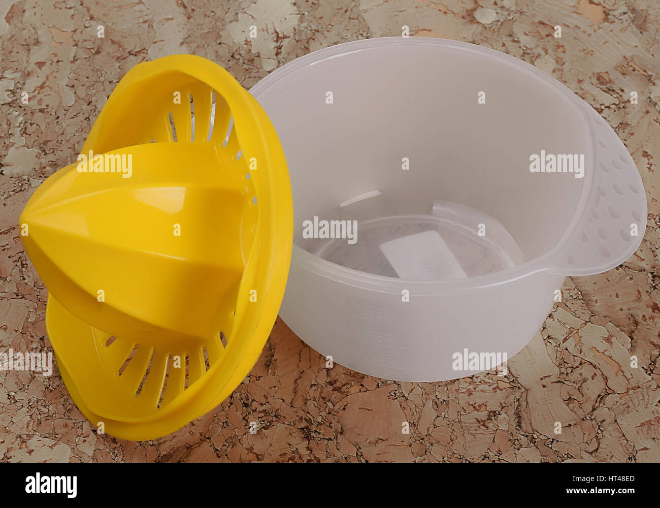 Plastic lemon-squeezer on cork background Stock Photo - Alamy