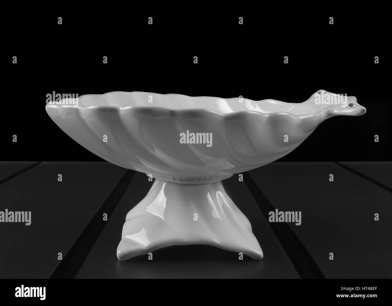 White porcelain fruit bowl-shaped shell. Front view Stock Photo - Alamy