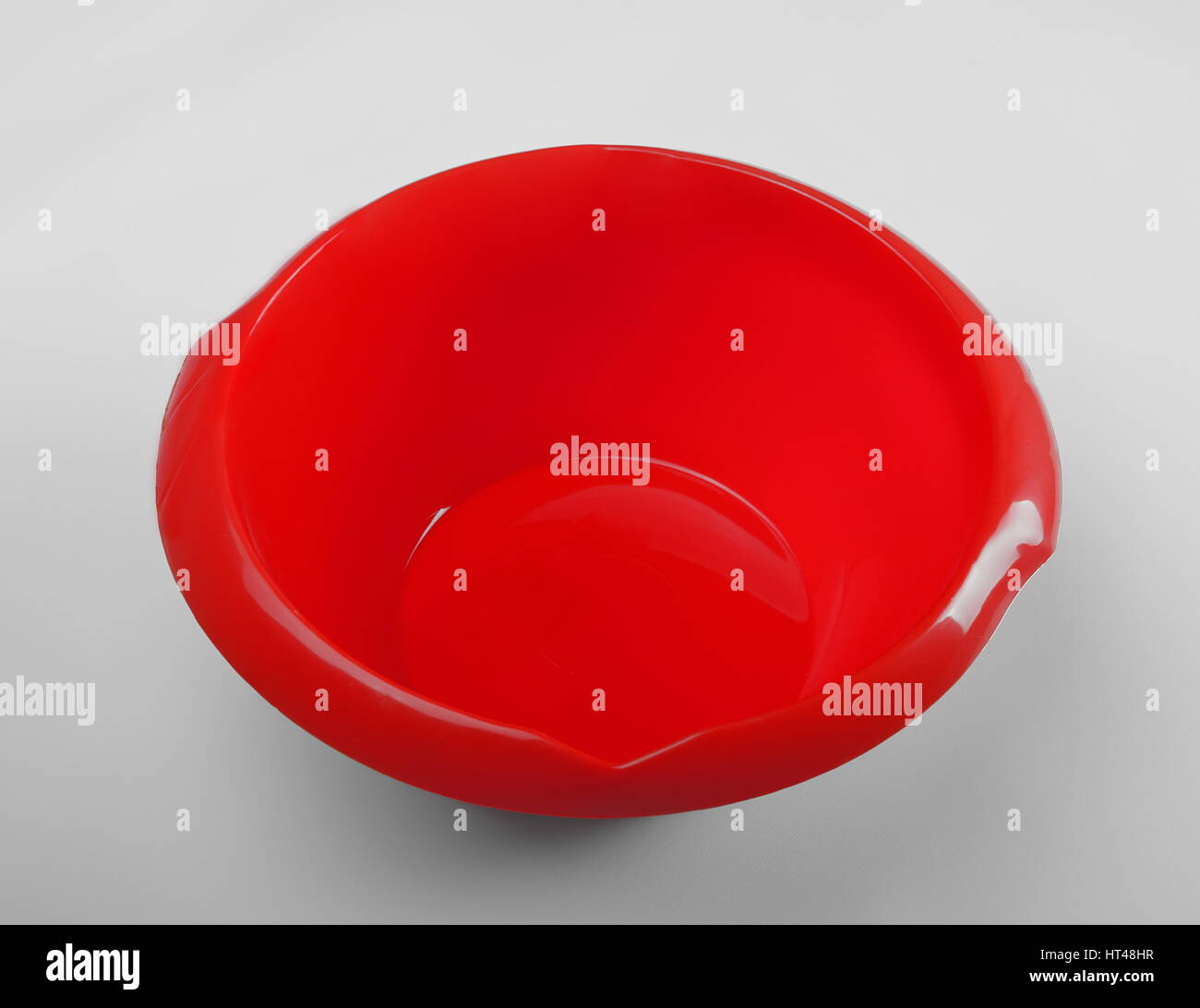 Red plastic deep bowl, isolated on white background Stock Photo - Alamy