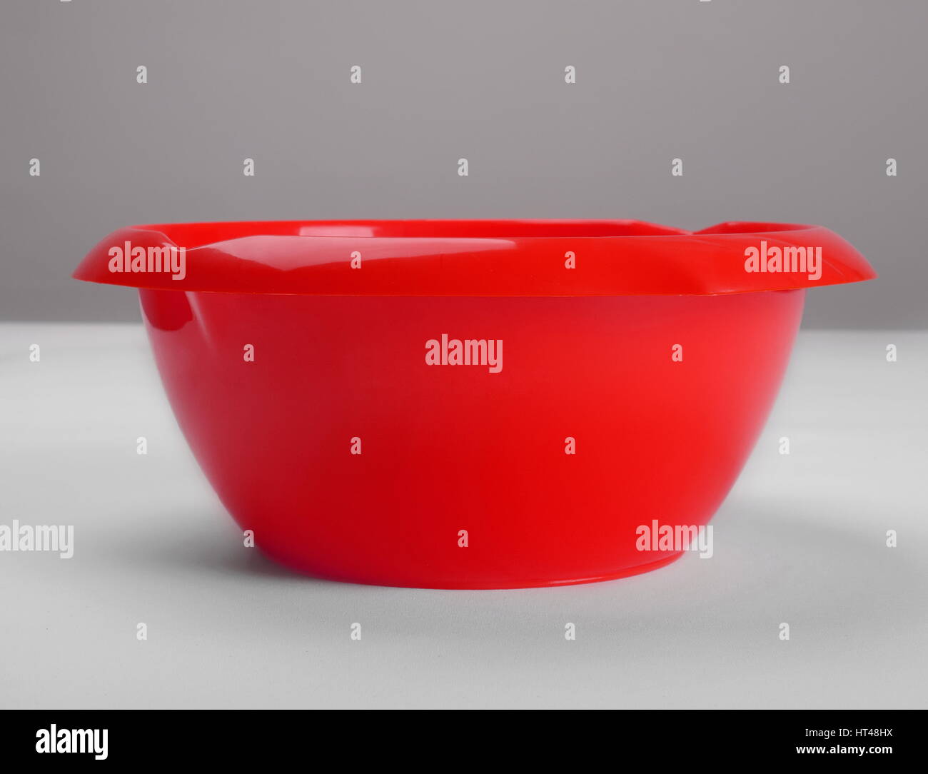 Red plastic deep bowl, front view Stock Photo - Alamy