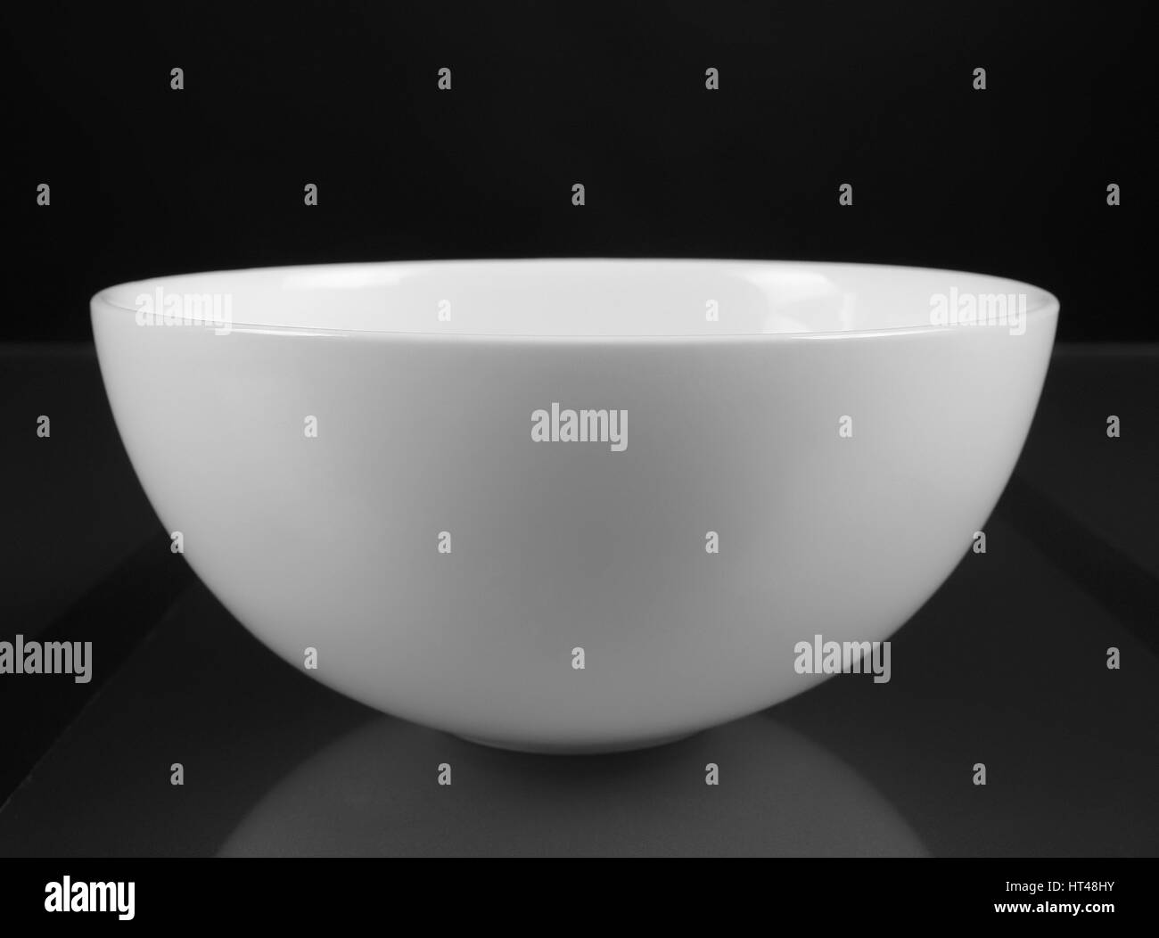 Deep and round porcelain dish. Front view Stock Photo - Alamy