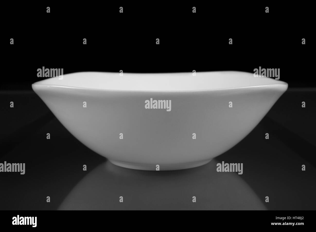 Deep porcelain dish. White bowl front view Stock Photo - Alamy