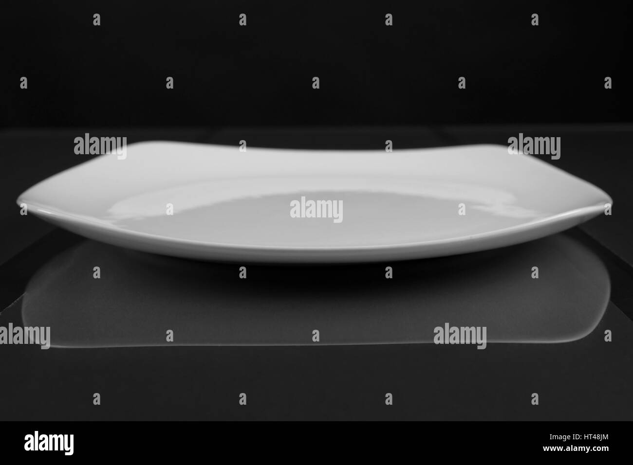 Porcelain square shallow dish Stock Photo - Alamy