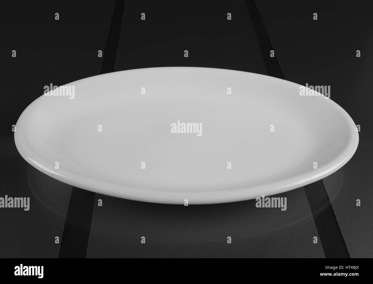 Porcelain round square shallow dish. Front view Stock Photo - Alamy