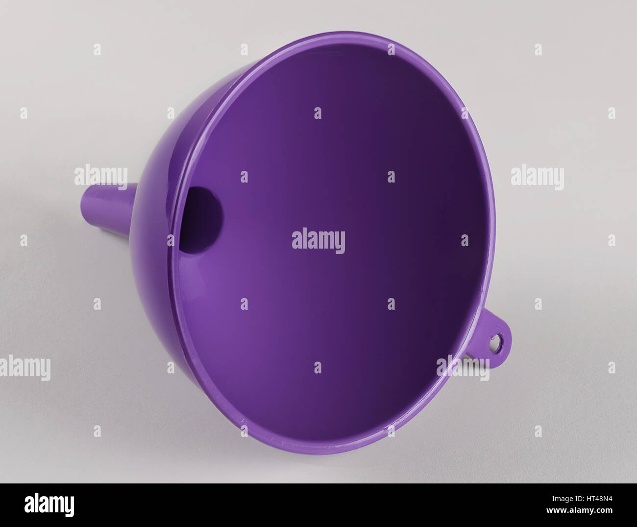 Purple plastic kitchen funnel liquid Stock Photo - Alamy