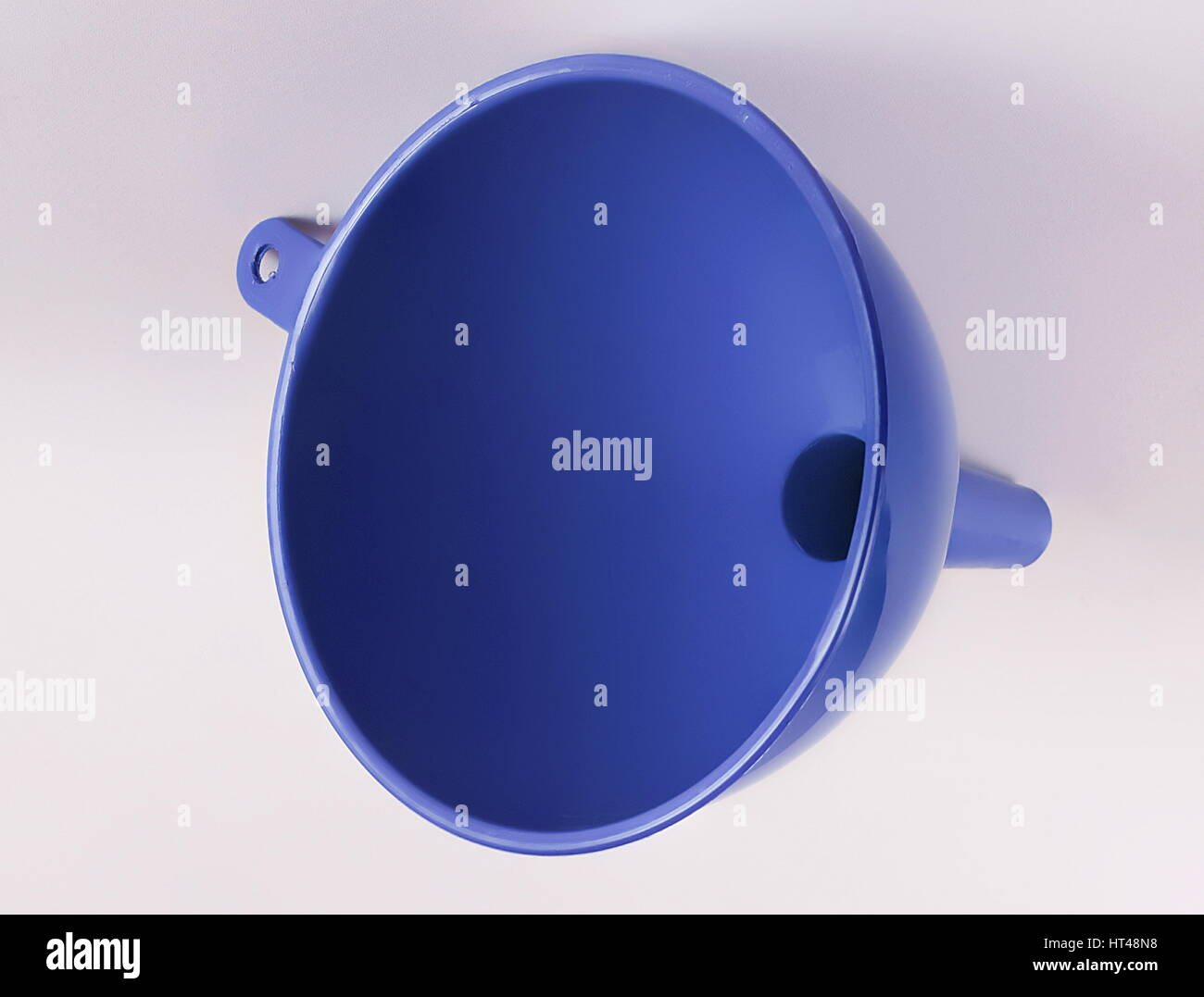 Blue plastic kitchen funnel liquid Stock Photo - Alamy