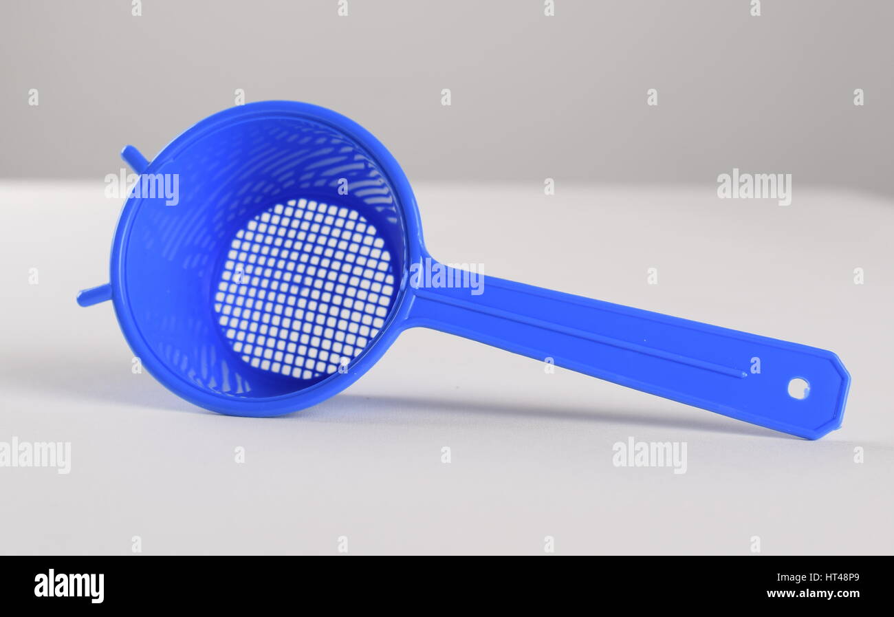 Blue plastic tea strainer isolated on white background Stock Photo - Alamy