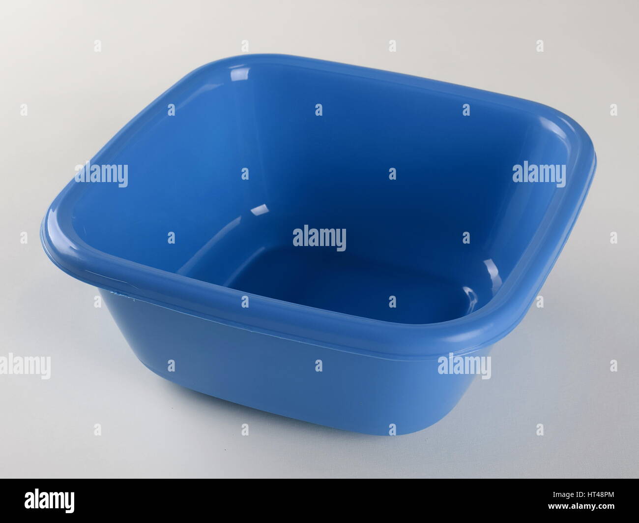Blue plastic deep bowl, isolated on white background Stock Photo - Alamy