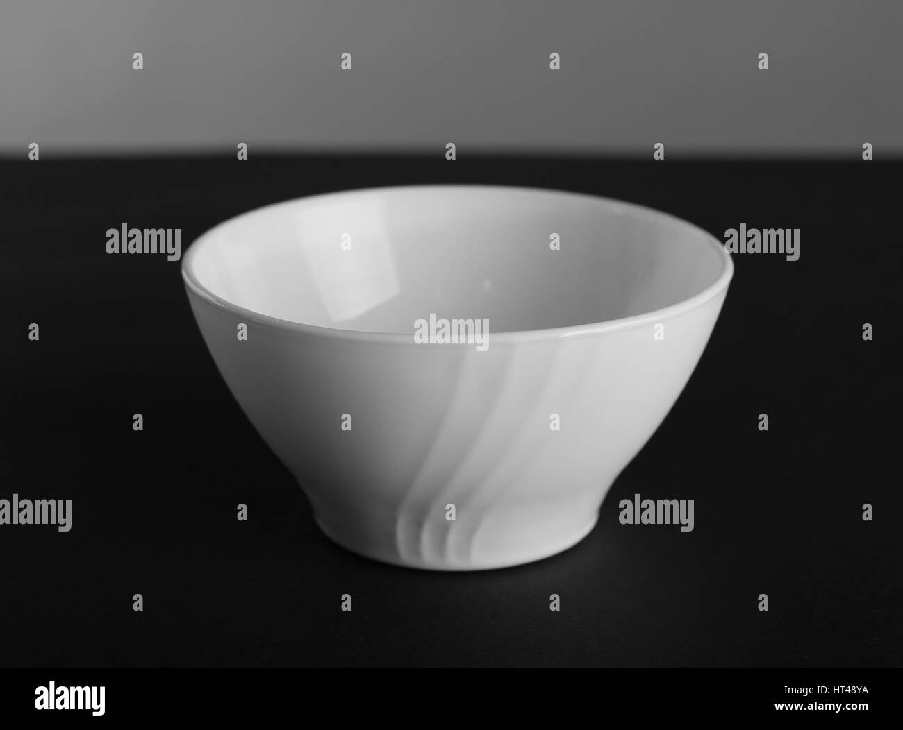 Deep round porcelain dish. White bowl front view Stock Photo - Alamy