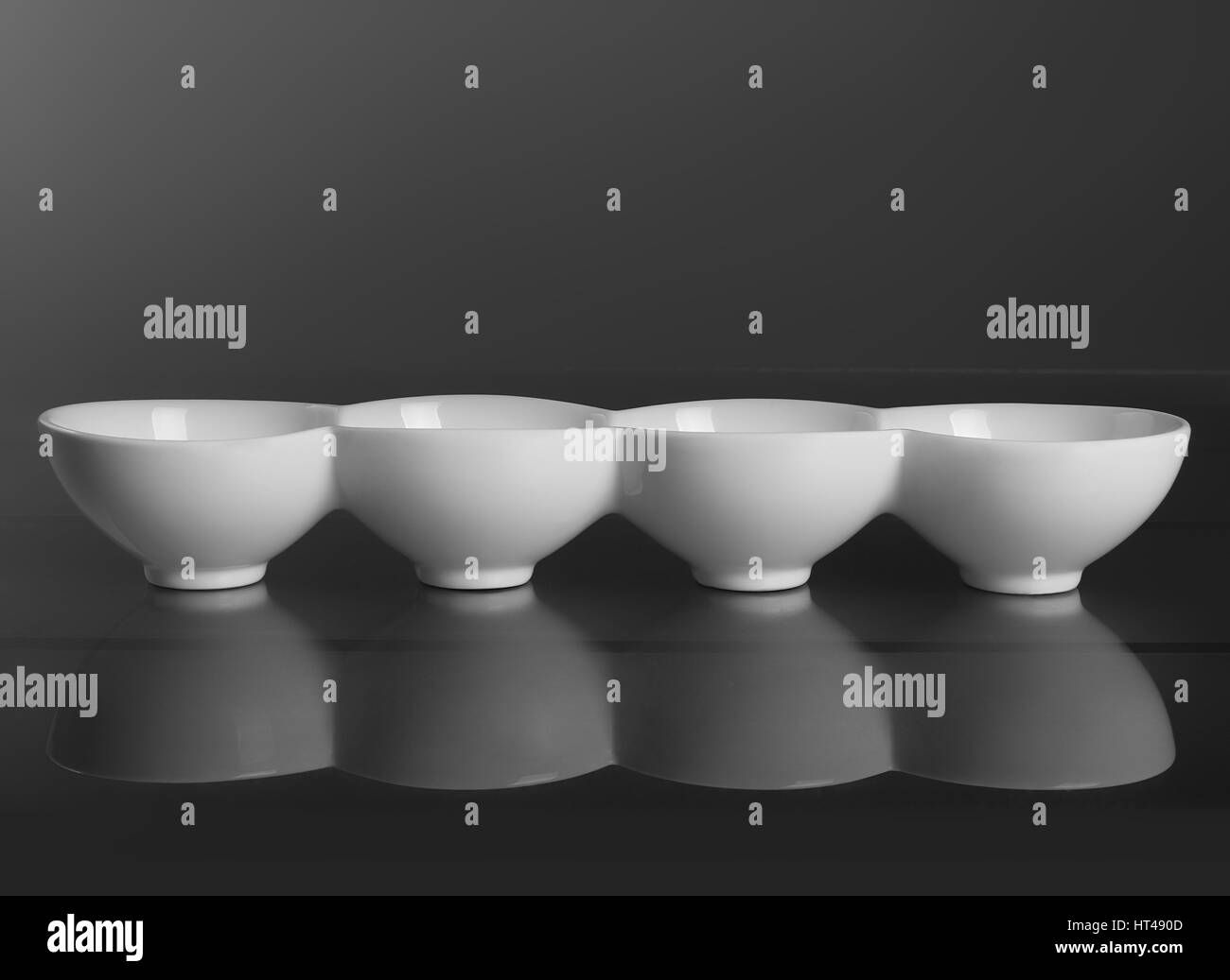 Round porcelain bowl with four compartments Stock Photo - Alamy