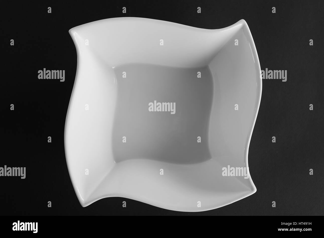 Deep round porcelain dish. White bowl top view Stock Photo - Alamy