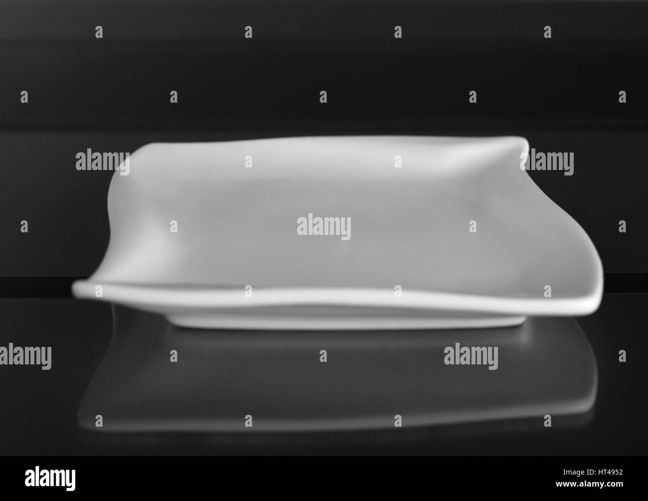 Porcelain square shallow dish Stock Photo - Alamy