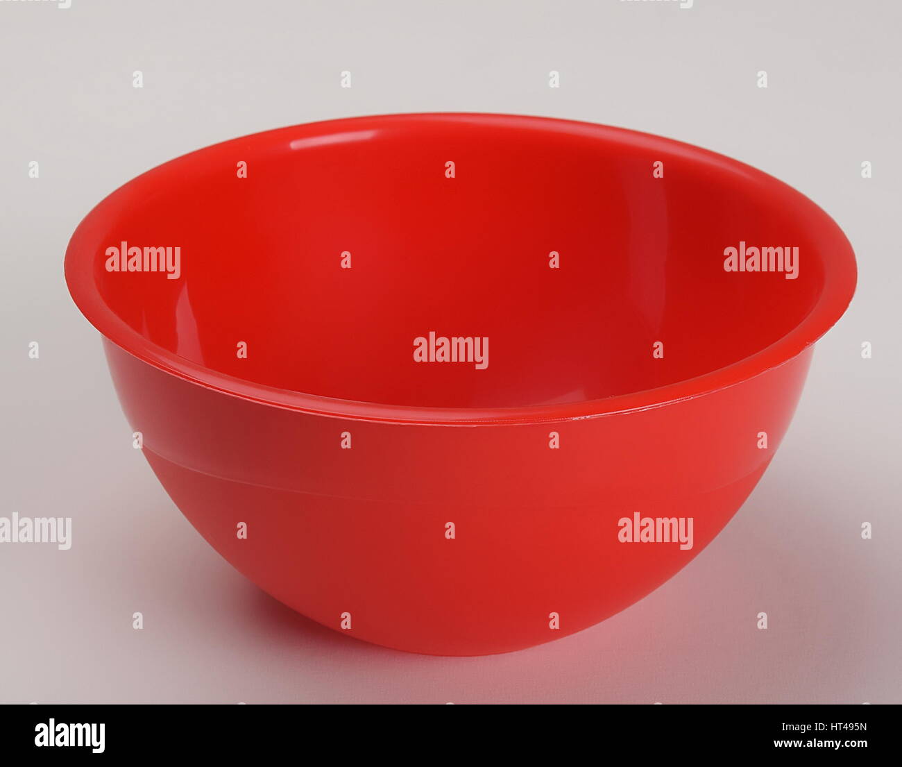 Red plastic deep dish, isolated on white background Stock Photo - Alamy