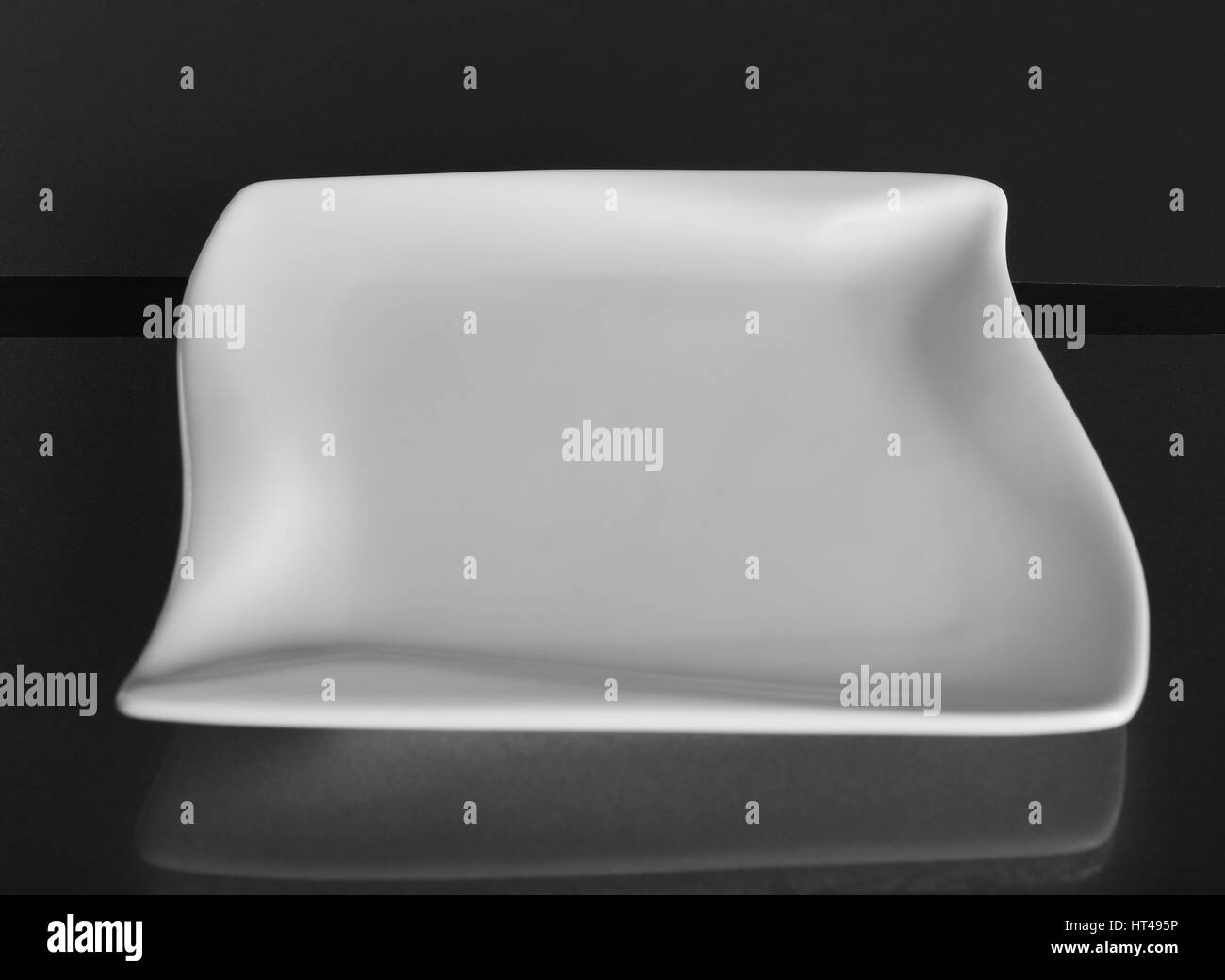 Porcelain square shallow dish Stock Photo - Alamy