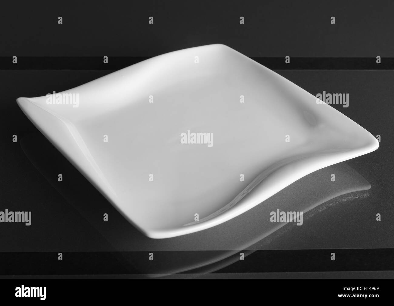 Porcelain square shallow bowl Stock Photo - Alamy