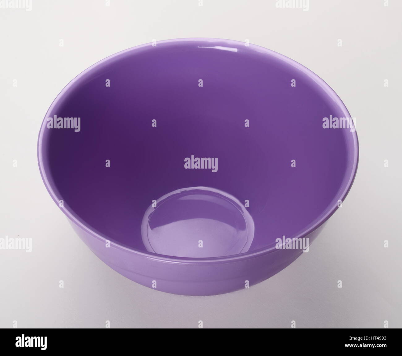 Purple plastic deep dish, isolated on white background Stock Photo - Alamy