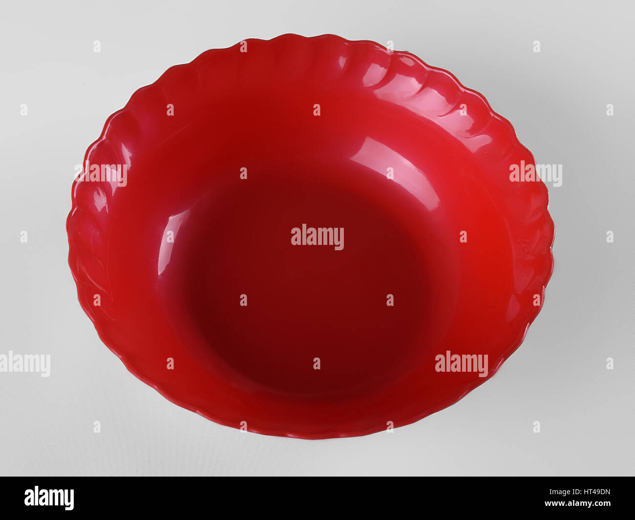 Red round plastic deep dish. top view Stock Photo - Alamy