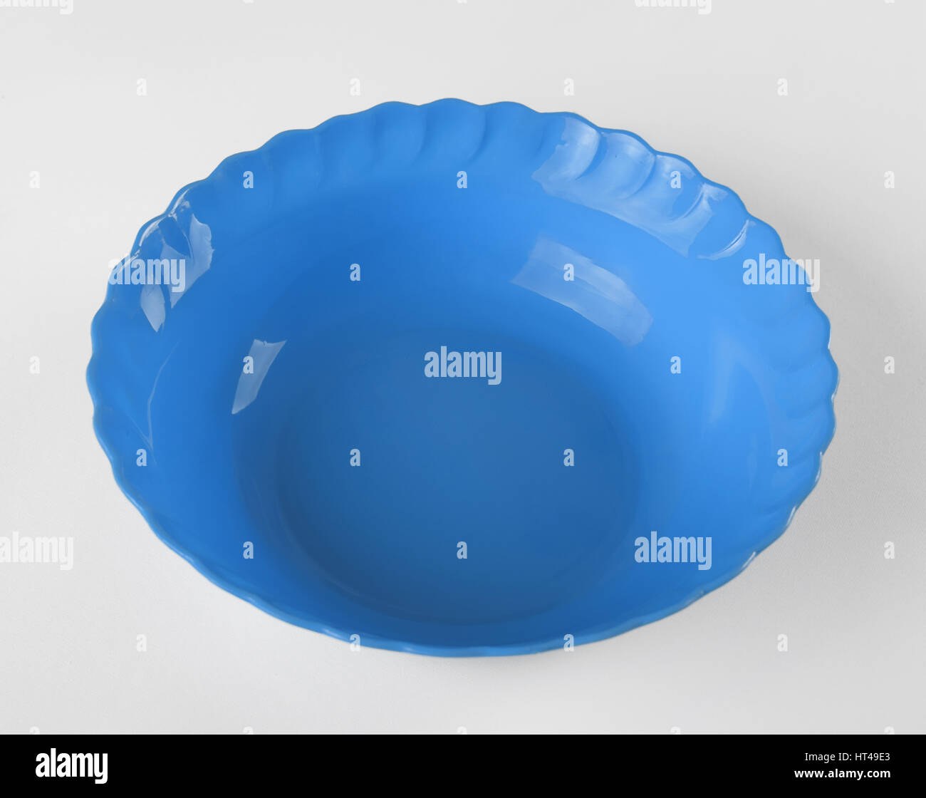 Blue round plastic deep dish Stock Photo - Alamy