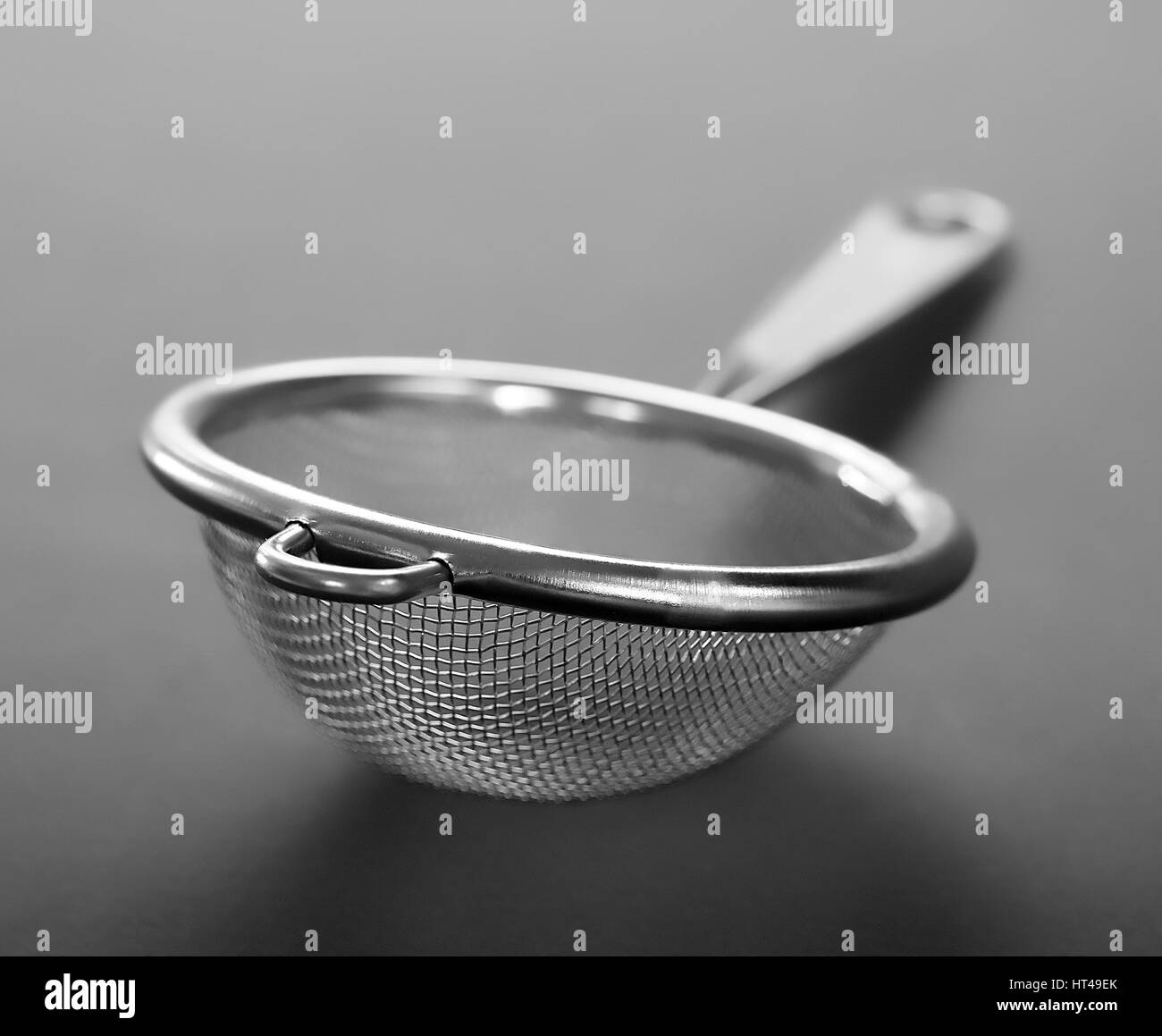 Close up of metallic strainer with plastic handle, a modern kitchen ...