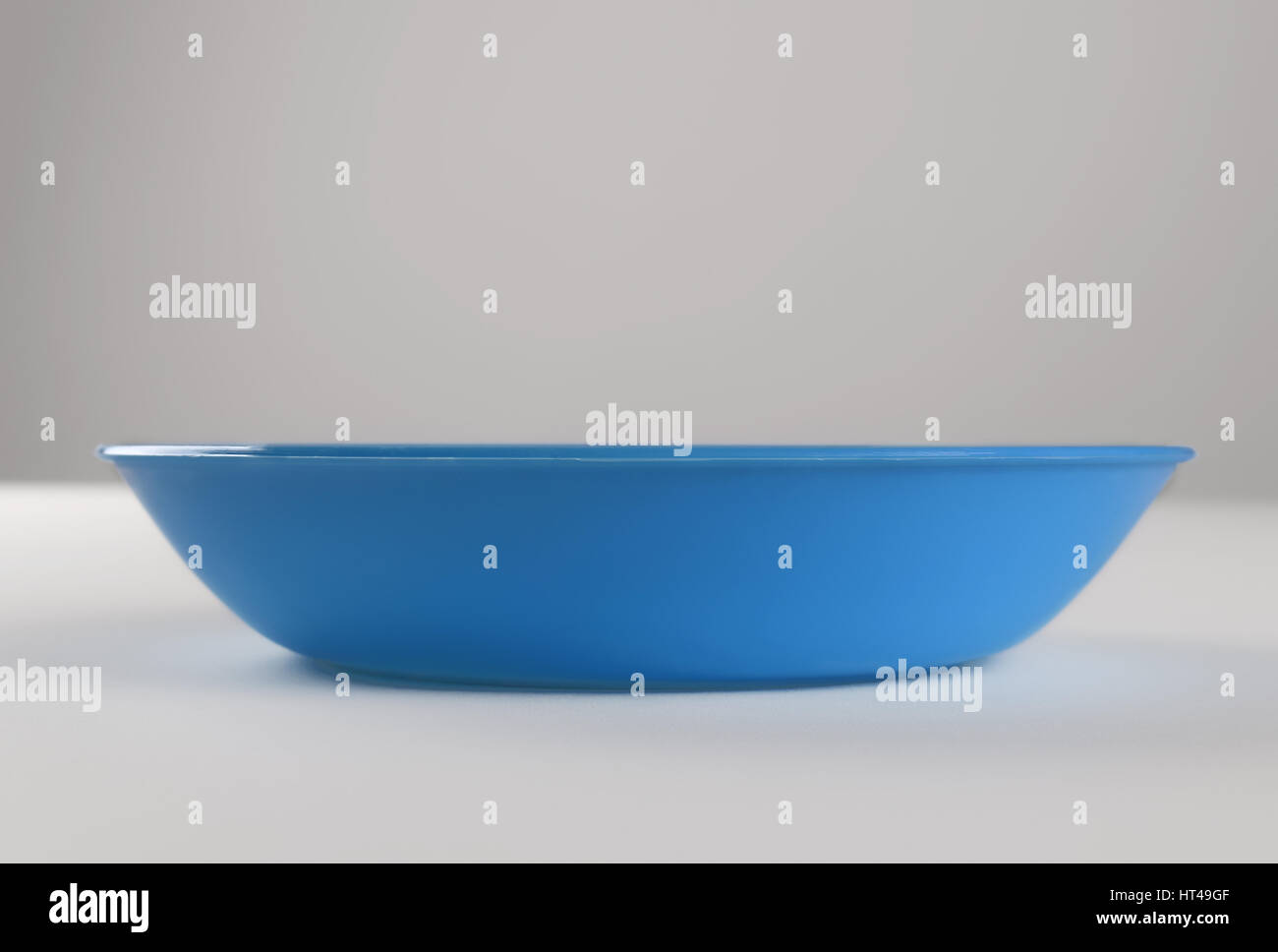 Blue plastic shallow dish food Stock Photo - Alamy
