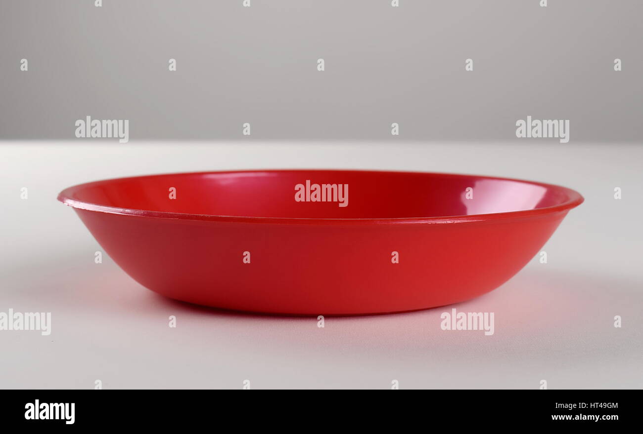 Red plastic shallow dish food Stock Photo - Alamy