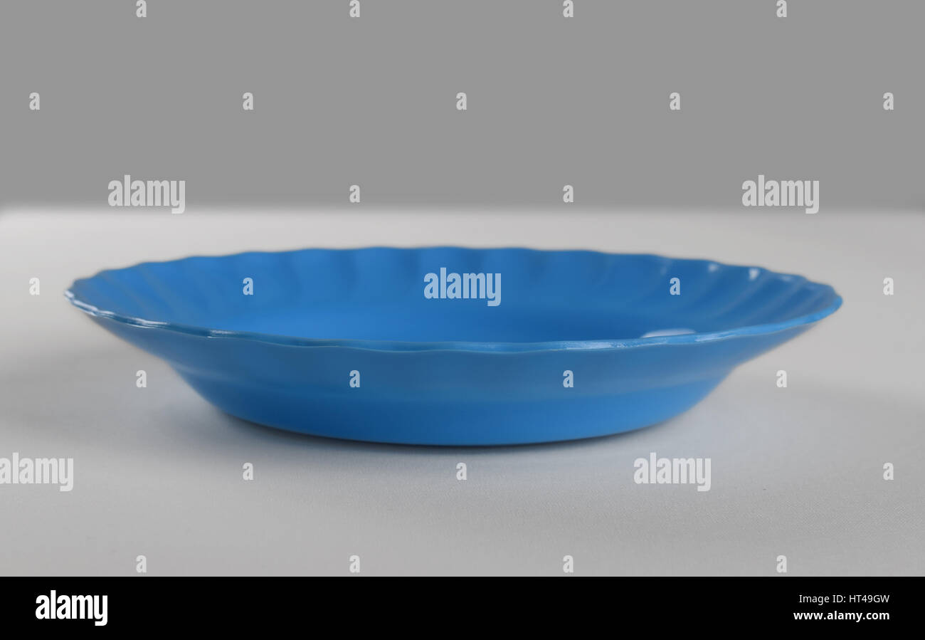 Blue plastic shallow dish food Stock Photo - Alamy