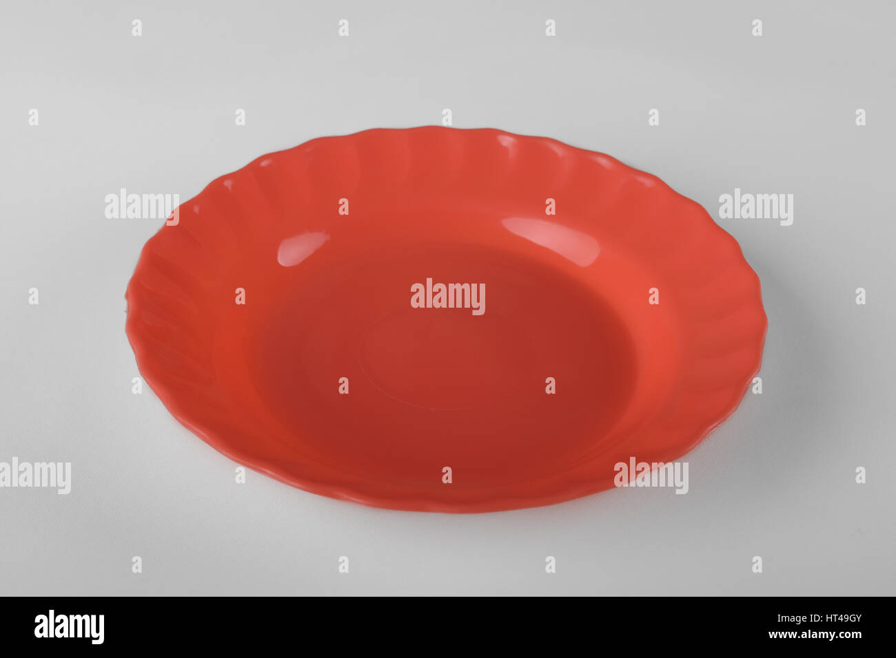 Red plastic shallow dish food Stock Photo - Alamy
