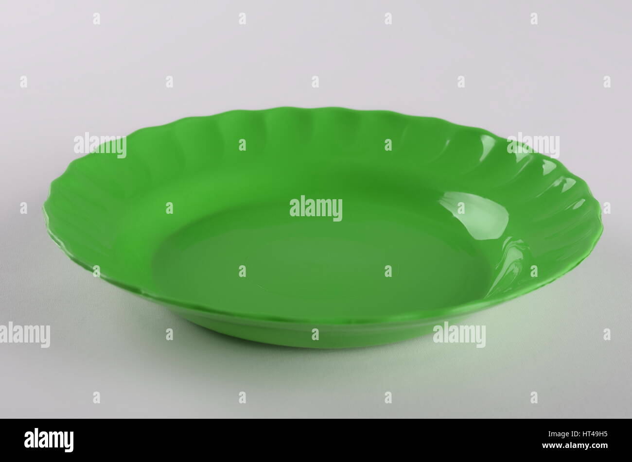 Green plastic shallow dish food Stock Photo - Alamy