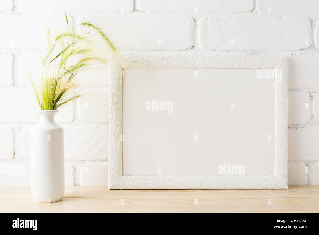 White landscape frame mockup with yellow and green wild grass ears in ...