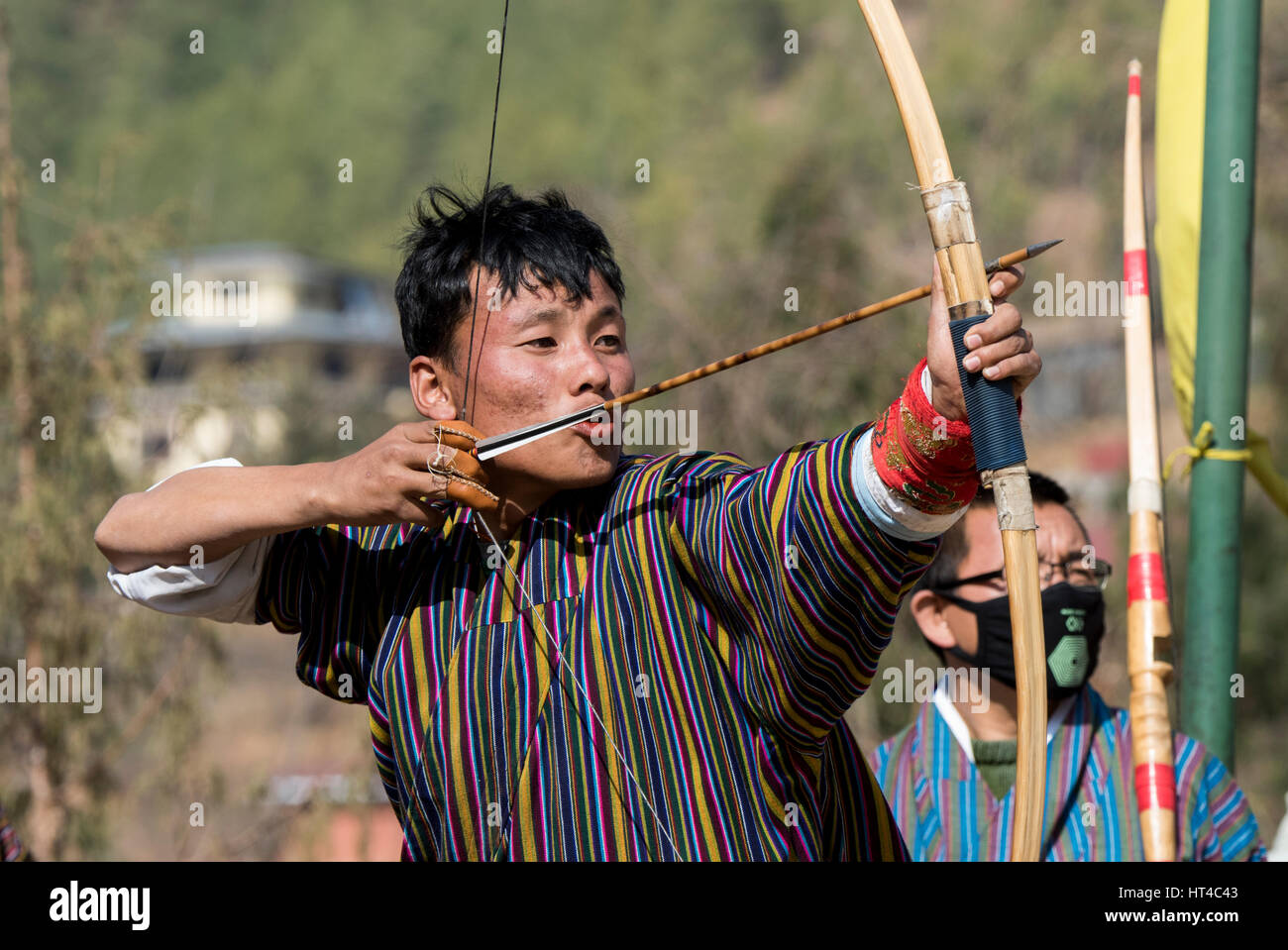 Bhutan, Thimphu, capital of Bhutan. Local archery competition played in ...