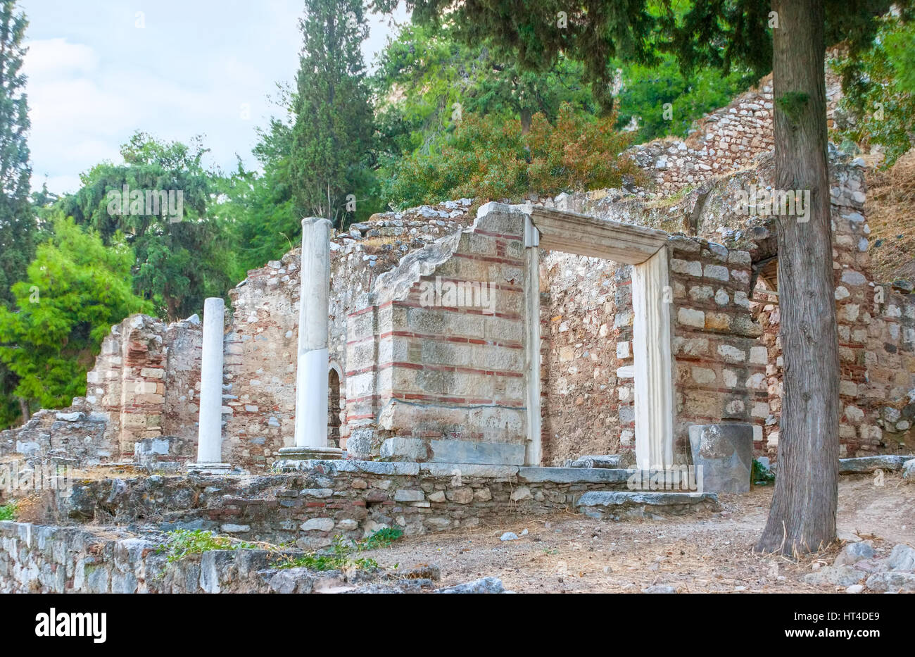 Antique ruins along round ancient peripatos street on the Hill of ...