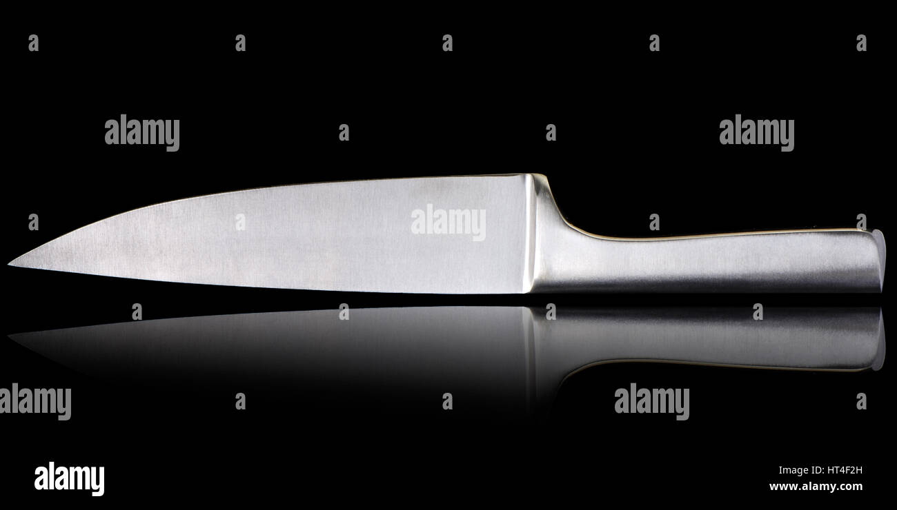 Brushed Silver Stainless Steel Chef's knife on black background with ...