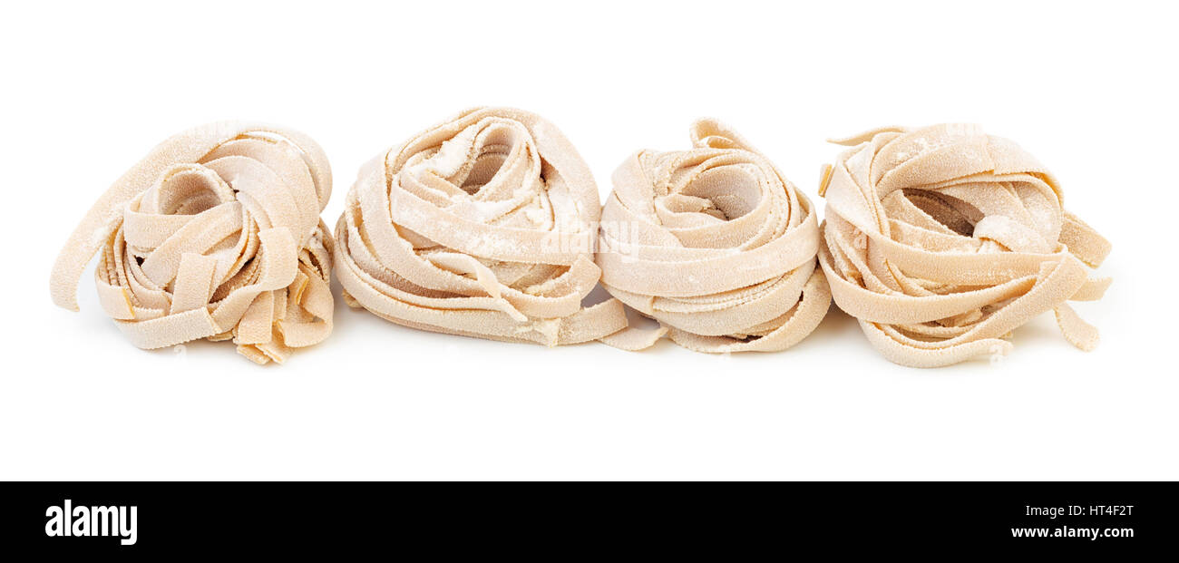 Homemade rolled traditional italian pasta in row isolated on white ...