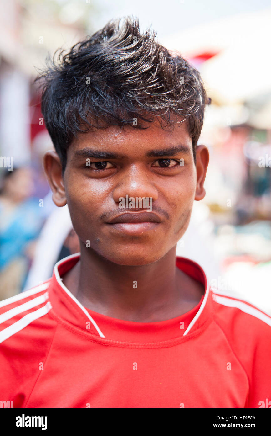 Smiling man at the Mapusa Market in North Goa, India. People from the ...