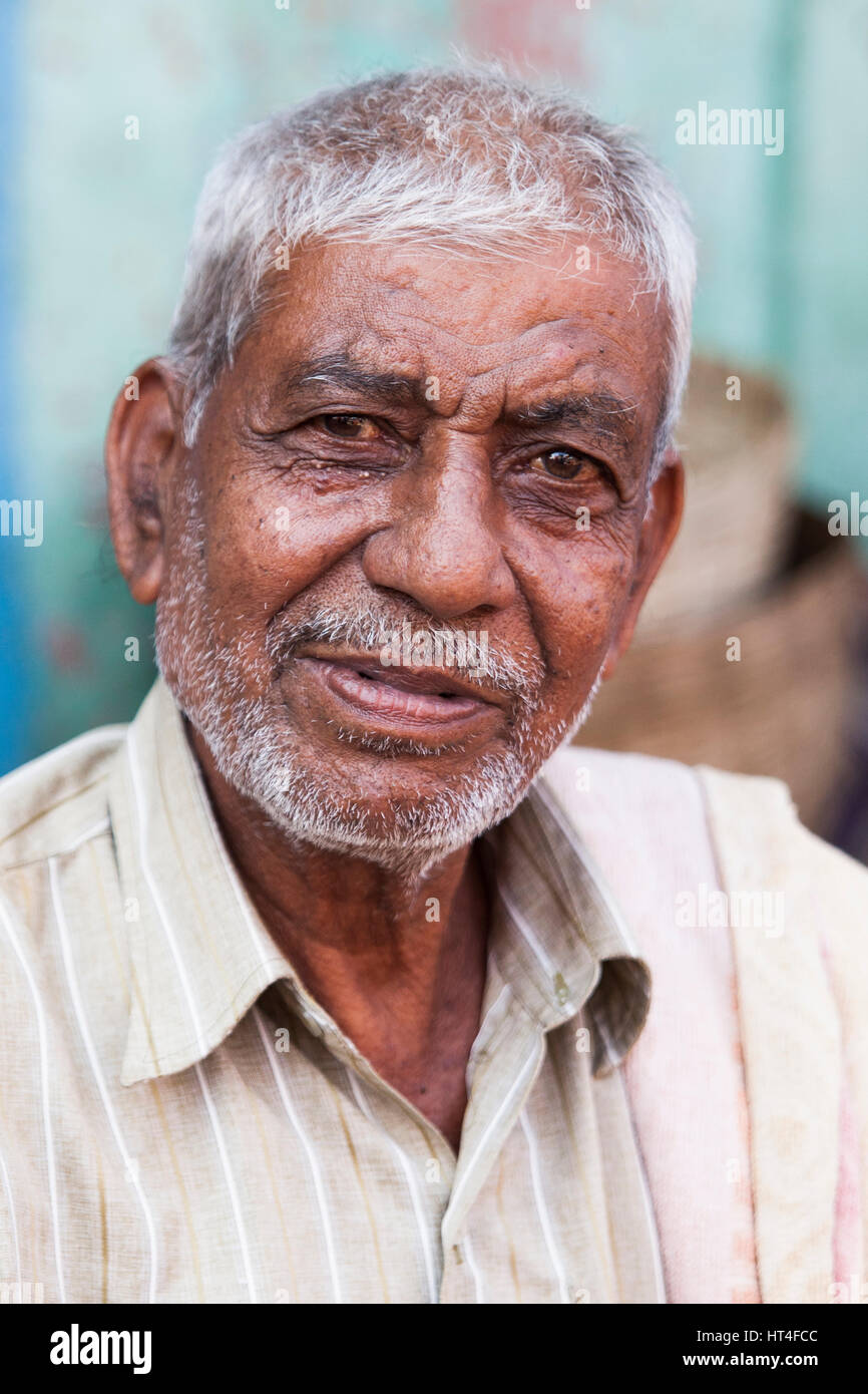 Smiling man at the Mapusa Market in North Goa, India. People from the ...