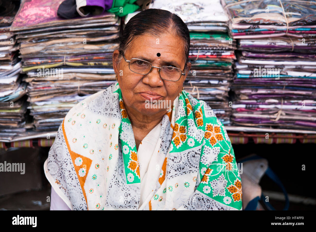 Woman selling goods at the Mapusa Market in North Goa, India. People ...