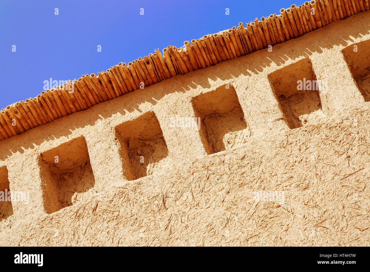 Rammed earth wall with beautiful blue sky Stock Photo - Alamy