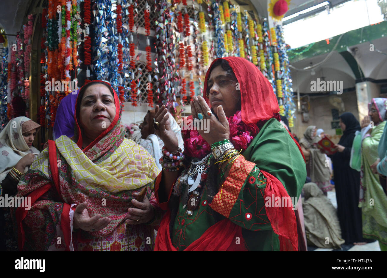 Lahore, Pakistan. 6th Mar, 2017. Pakistani women devotees bringing ...