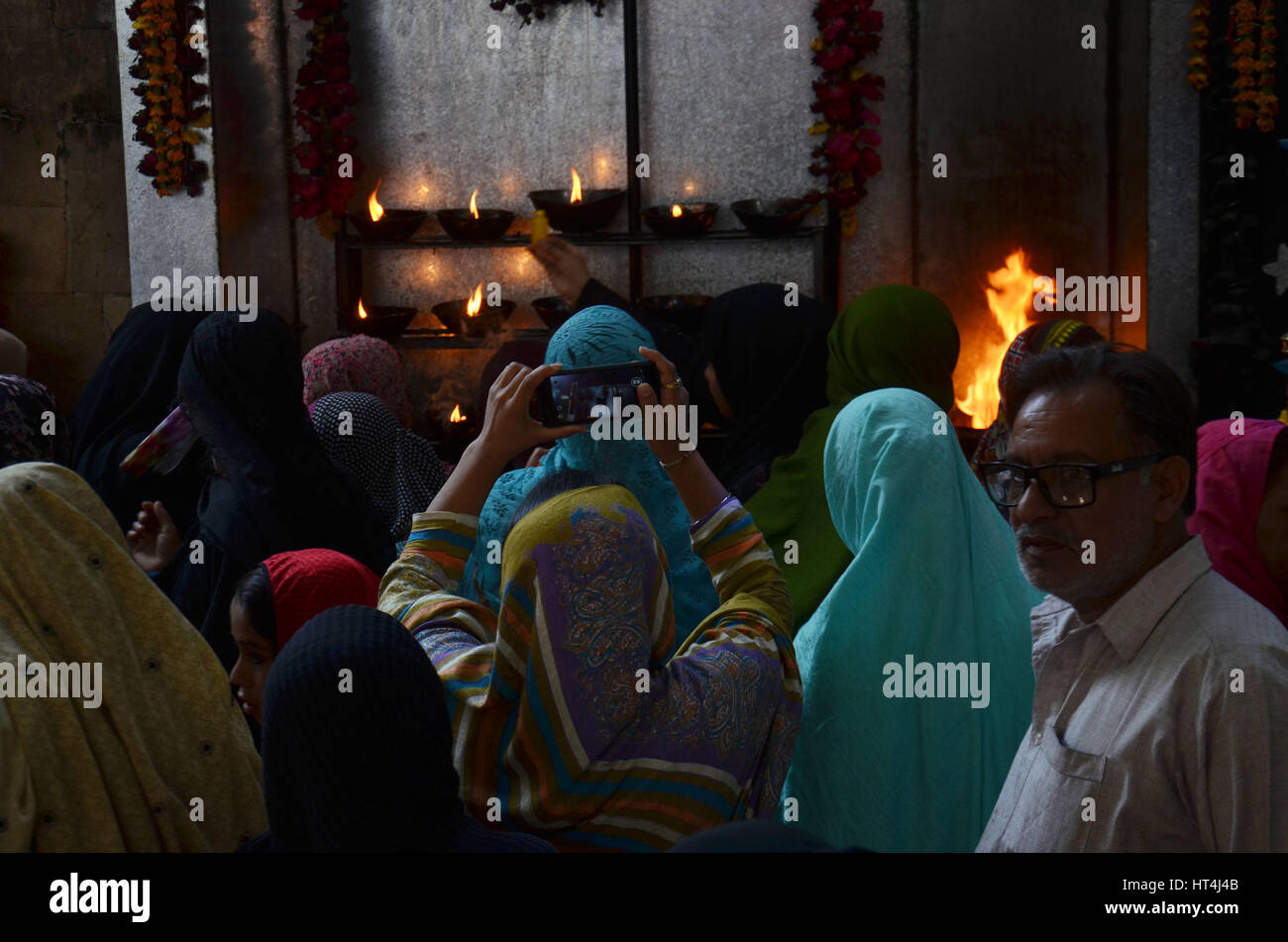 Lahore, Pakistan. 6th Mar, 2017. Pakistani women devotees bringing ...
