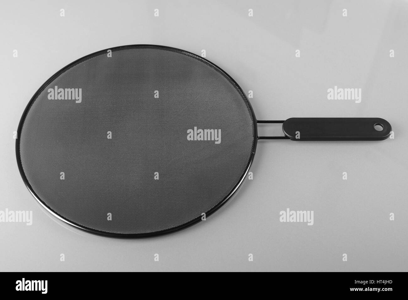 Non-stick splatter screen isolated on white background Stock Photo - Alamy