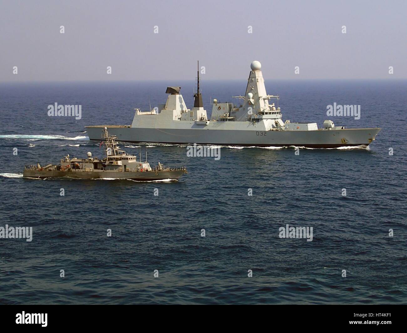 The USN Cyclone-class coastal patrol ship USS Monsoon (left) steams in ...