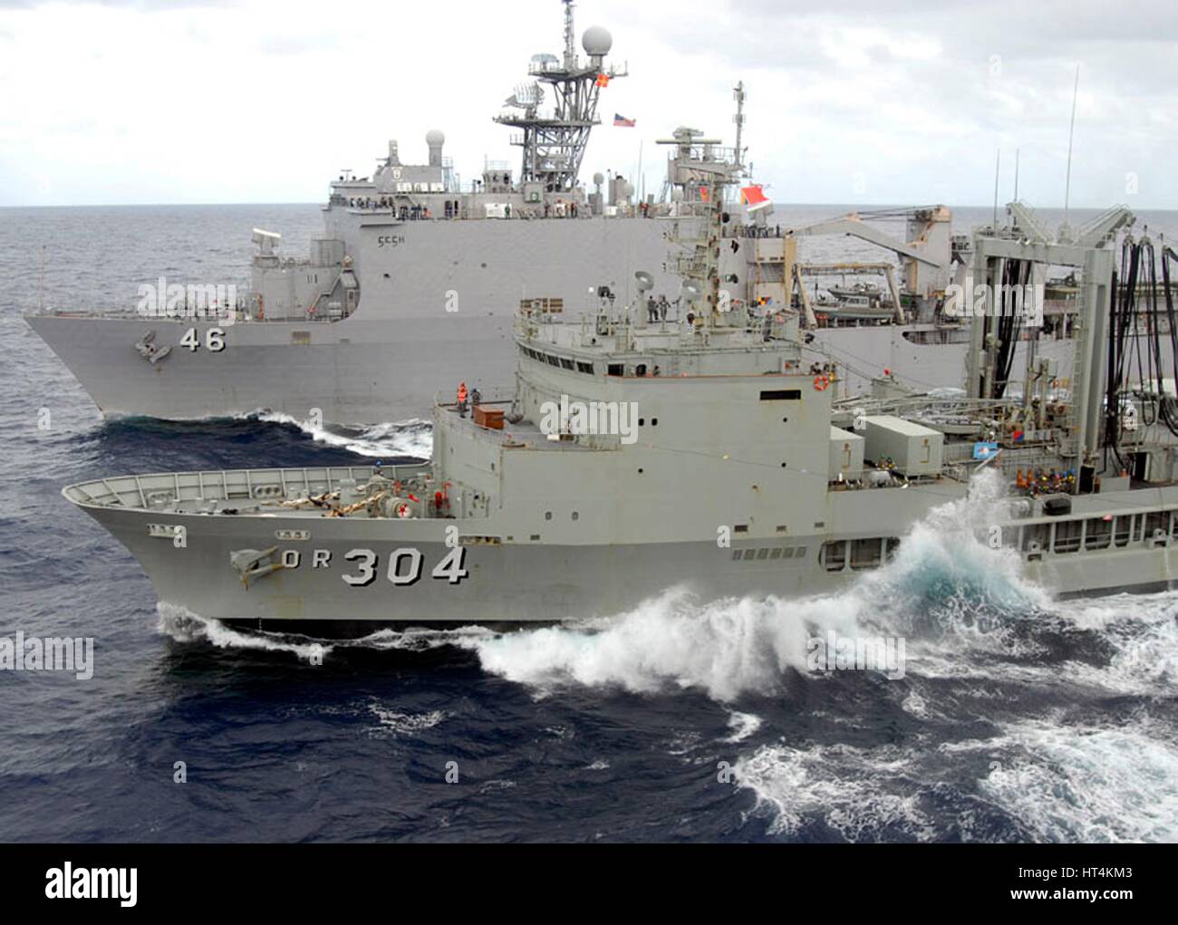 The USN Whidbey Island-class dock landing ship USS Tortuga (left ...