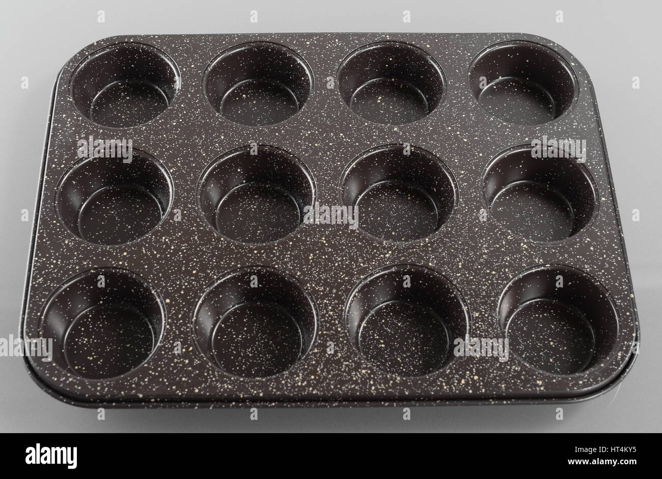 Cooking, baking and home concept. Close up of empty muffins molds Stock ...
